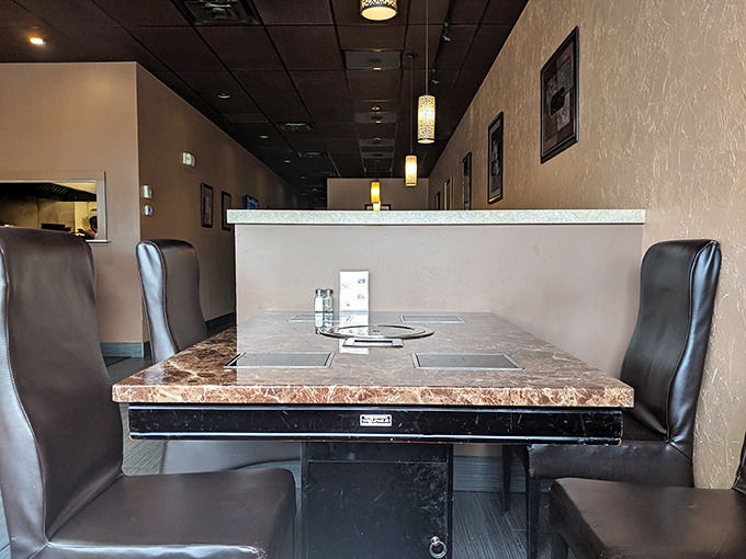 Elegant simplicity defines the dining space, where those high-backed leather chairs practically whisper, "Stay awhile, the seafood feast deserves your full attention."