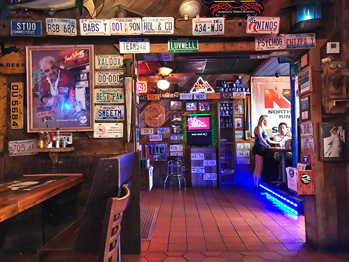 License plates from across America line the walls, each telling a story of travelers who found their way to this seafood sanctuary.