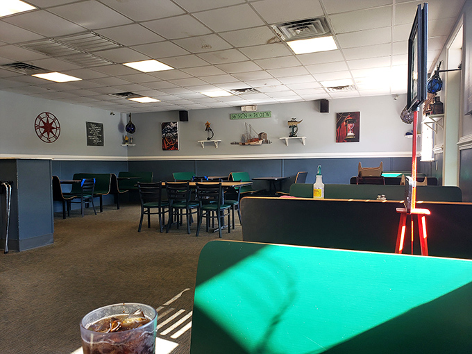 Inside, the blue wainscoting and green tabletops create a nautical vibe that says, "Relax, sailor, your breakfast voyage is about to begin."