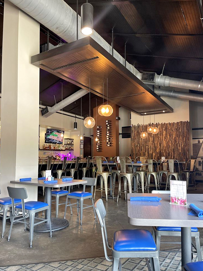 Industrial chic meets cozy comfort in Station 101's thoughtfully designed interior, where exposed ductwork and warm pendant lighting create the perfect backdrop for culinary adventures.
