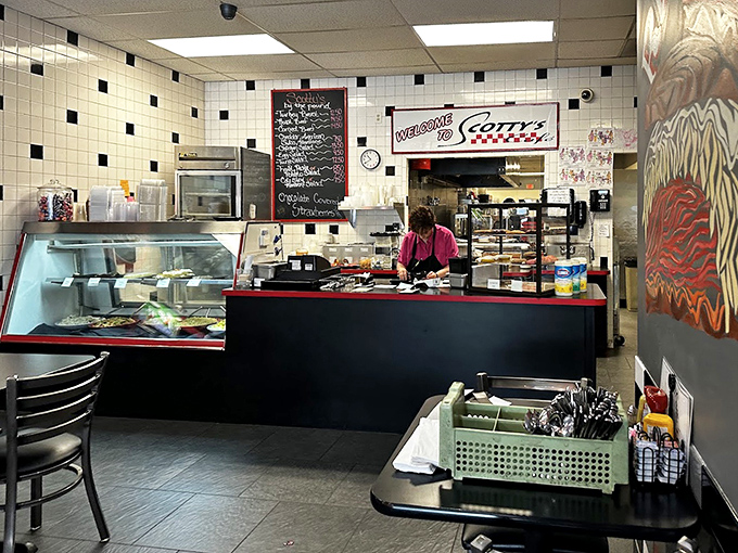 Behind the counter, where magic happens daily, the classic black-and-white tiled walls whisper of diners past while promising comfort food futures.