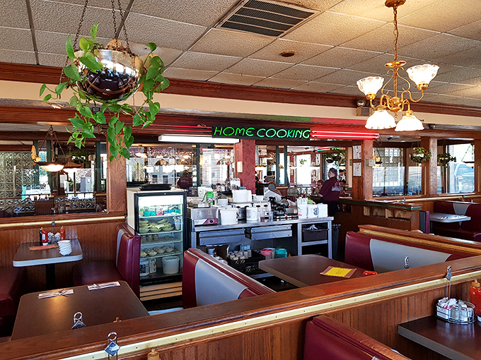 That neon "HOME COOKING" sign isn't just decoration &ndash; it's truth in advertising that glows with the promise of comfort food perfection.