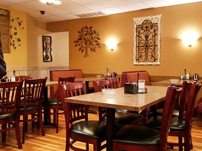 Warm golden walls, wooden chairs, and homey decor create that rare atmosphere money can't buy&mdash;the feeling you've stumbled into someone's well-loved dining room.