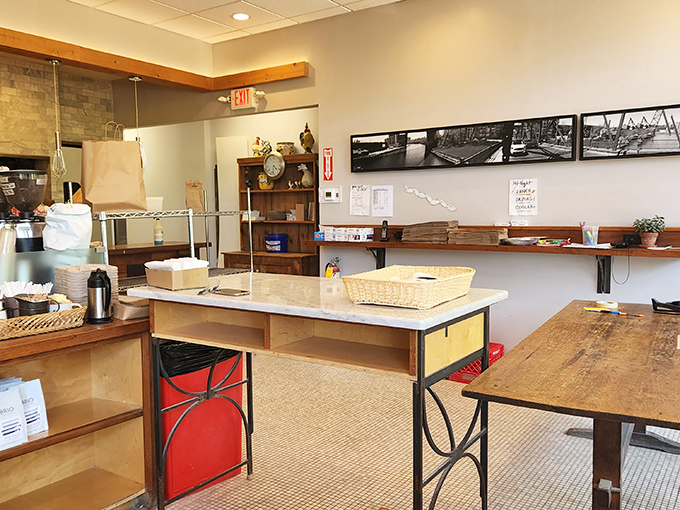 Behind the scenes where the magic happens. This no-frills workspace is where flour, water, and passion transform into edible art that sells out daily.