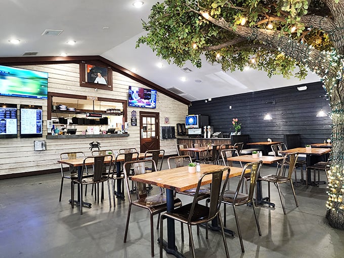 Step inside to discover rustic-industrial charm and that magnificent indoor tree. The twinkling lights create a dining atmosphere that's somehow both trendy and timeless.