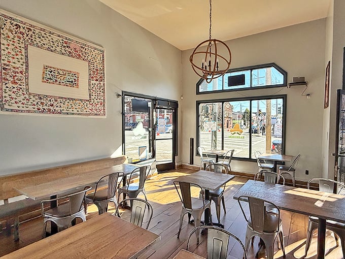 Inside, time slows down as you navigate a wonderland of cowboy hats, snacks, and those charming red chairs beckoning you to sit a spell.