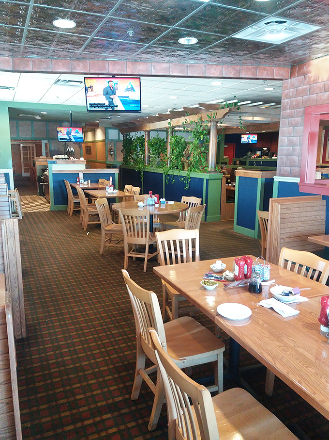 Inside Broadway Diner, wooden tables and green dividers create that perfect "everybody knows your name" atmosphere where breakfast dreams come true.