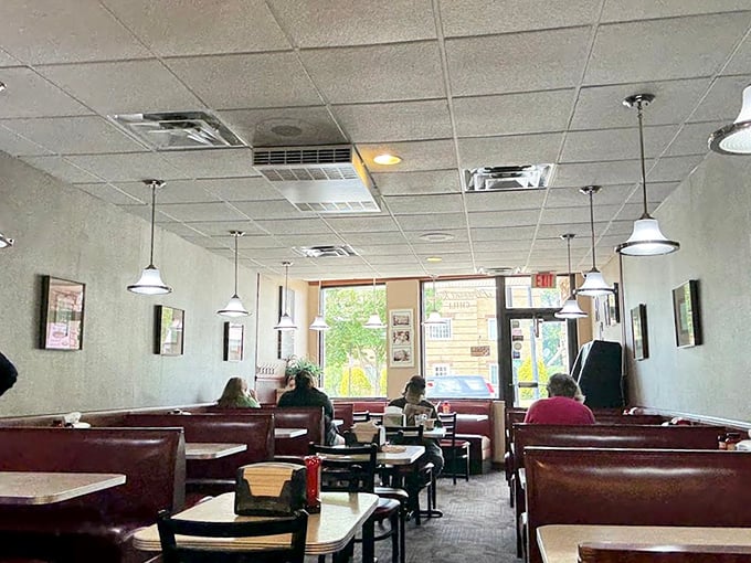 Classic burgundy booths and simple tables create the perfect no-frills atmosphere where the food, not the decor, takes center stage.