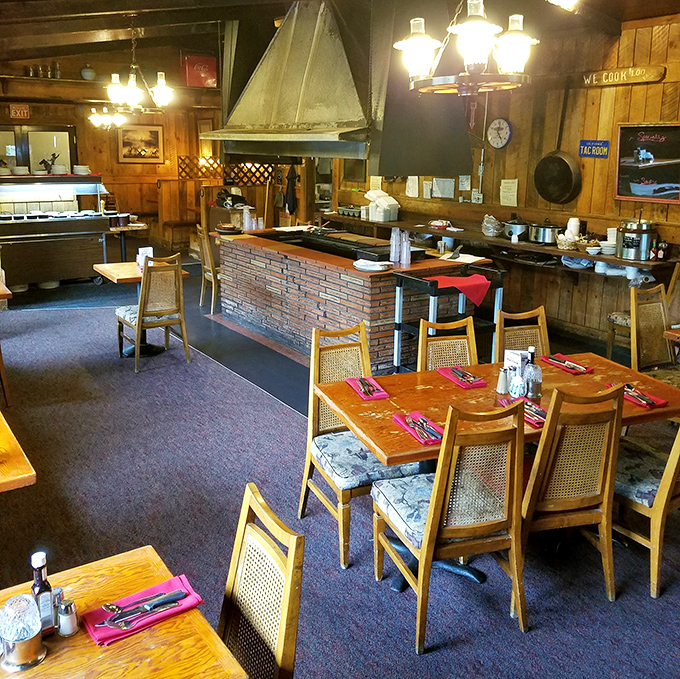 Rustic wood paneling and nautical accents create that rare atmosphere where you instantly feel like a regular, even on your first visit.