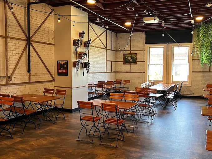 Inside the beer garden, cream-colored brick walls and wooden cross-beams create an atmosphere that whispers "stay awhile" – Munich's living room transported to Florida.