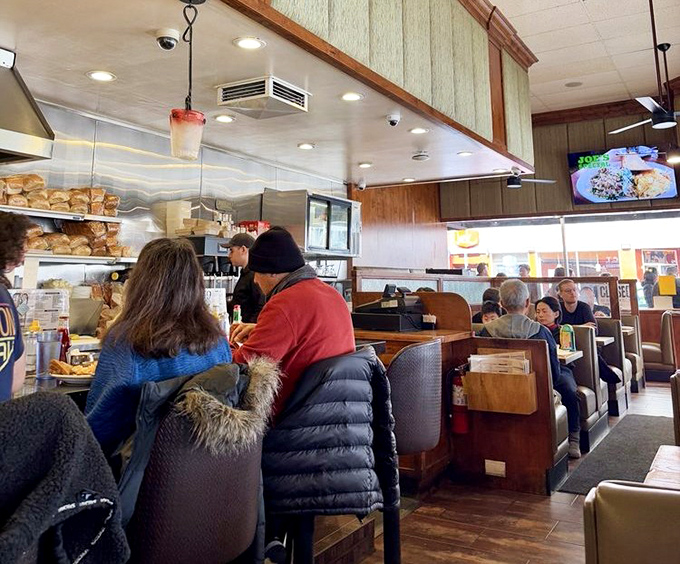 Classic wooden booths and counter seating&mdash;where strangers become temporary breakfast companions and the coffee never stops flowing.