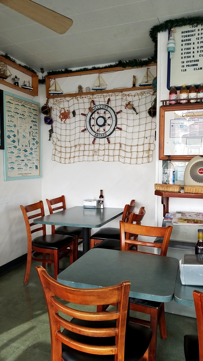 Nautical charm abounds inside with fishing nets, model ships, and a "Welcome Aboard" sign that instantly transports you from suburban Sacramento to seaside England.