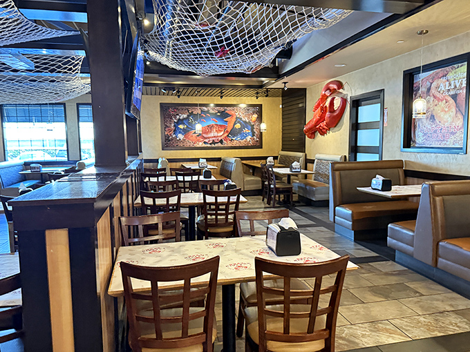 Fishing nets overhead and nautical decor set the stage for seafood theater. This isn't Instagram-bait design&mdash;it's the authentic backdrop for serious eating.
