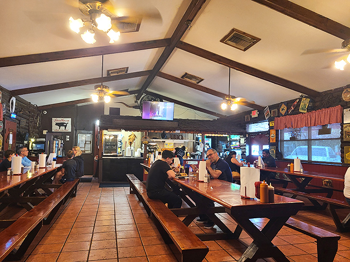 Wooden picnic tables and rustic charm set the stage for the meat-centric drama about to unfold on your plate.