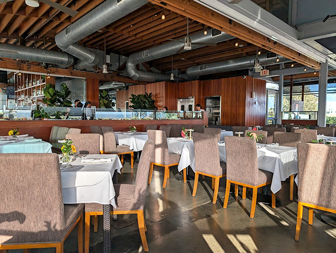 Wooden beams, exposed ductwork, and those crisp white tablecloths&mdash;this isn't just a restaurant, it's California coastal sophistication without the stuffiness.