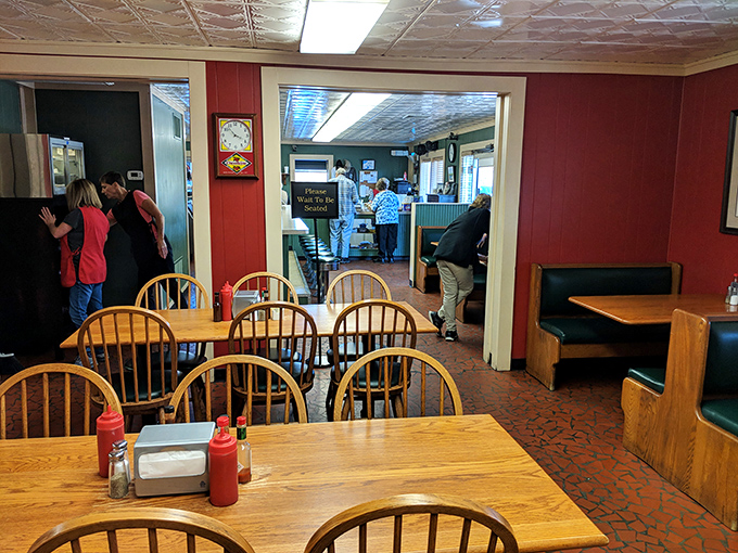 Red walls and wooden chairs create the perfect backdrop for barbecue bliss. Like Grandma's dining room, if Grandma was a smoke-whispering genius.