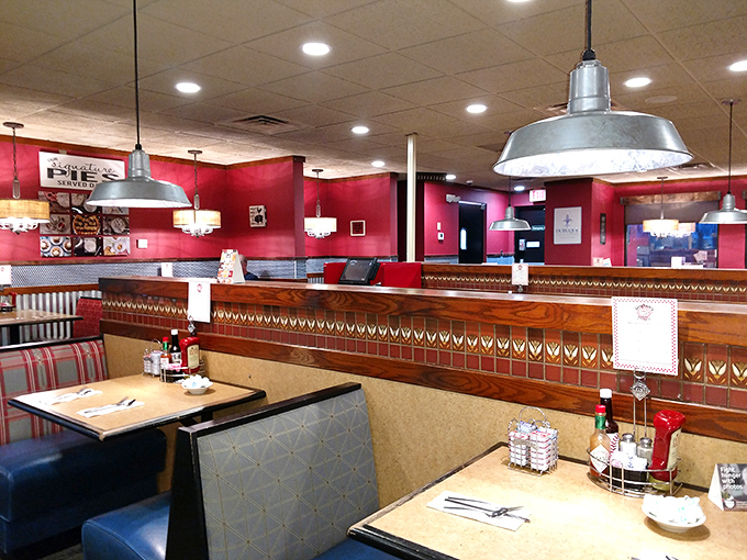 Red walls and industrial lighting create the perfect backdrop for life-changing meals. These booths have witnessed countless first dates, family celebrations, and food epiphanies.