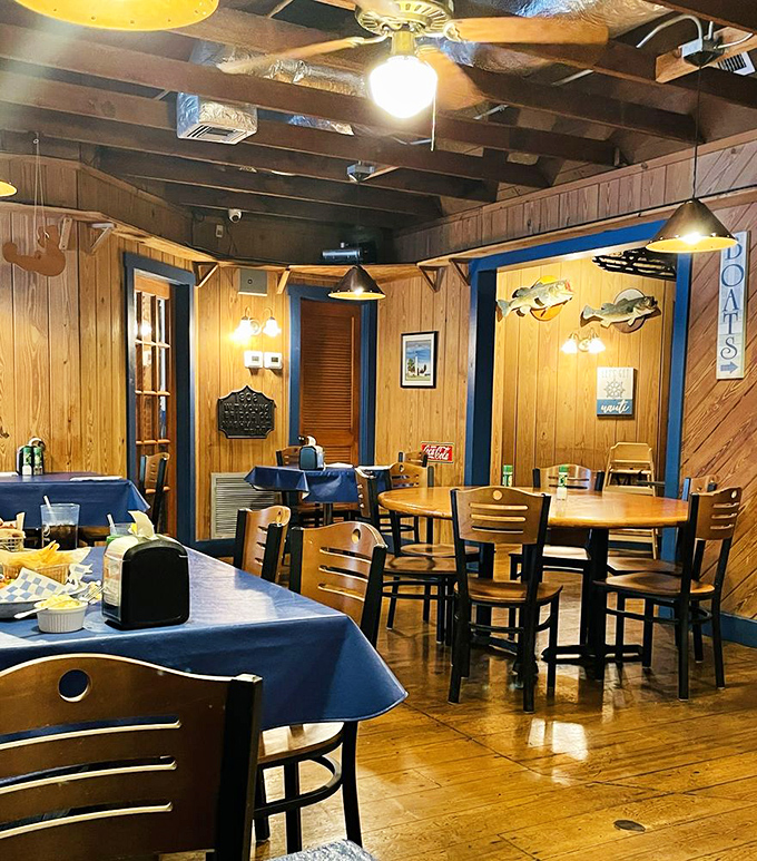 Step inside and you're transported to a New England fishing lodge, where wood-paneled walls, blue tablecloths, and mounted fish create the perfect backdrop for seafood indulgence.