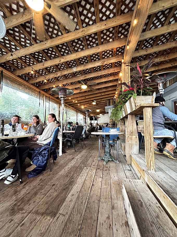 Dining beneath a wooden canopy where string lights twinkle like stars. This isn't just a meal; it's dinner in the treetops.