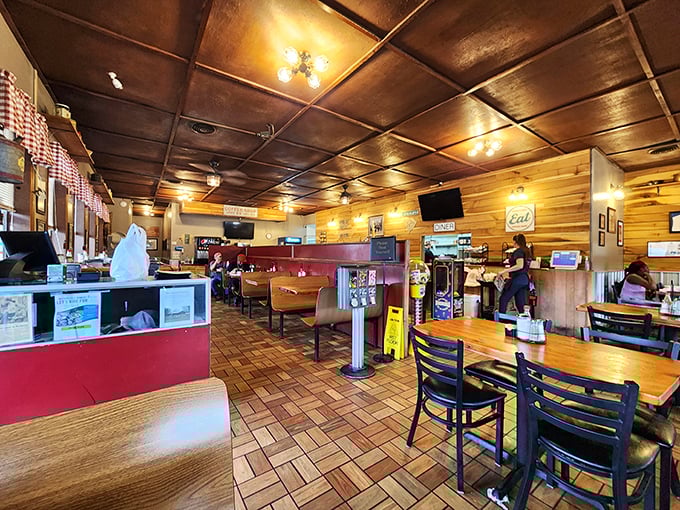 Wood paneling and red booths create the perfect backdrop for conversations that flow as freely as the coffee refills.