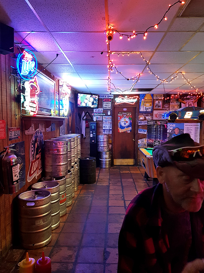 Step inside and time stands still. Beer kegs, neon signs, and string lights create the perfect dive bar atmosphere where burger dreams come true.