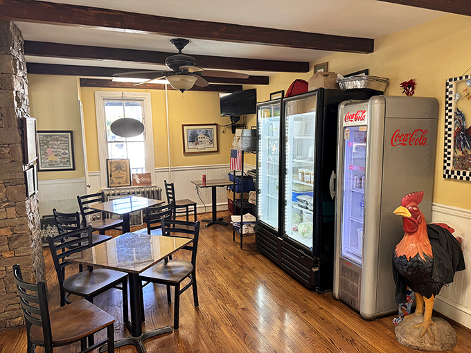 Inside, exposed beams and sunny yellow walls create the perfect backdrop for comfort food conversations. That rooster statue? He's the unofficial greeter.