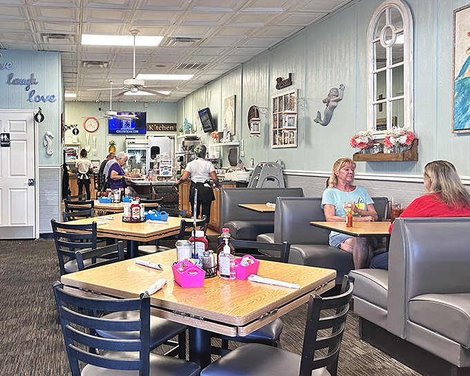 Blue walls and cozy booths create the perfect backdrop for breakfast magic. This isn't just a restaurant&mdash;it's Florida's living room.