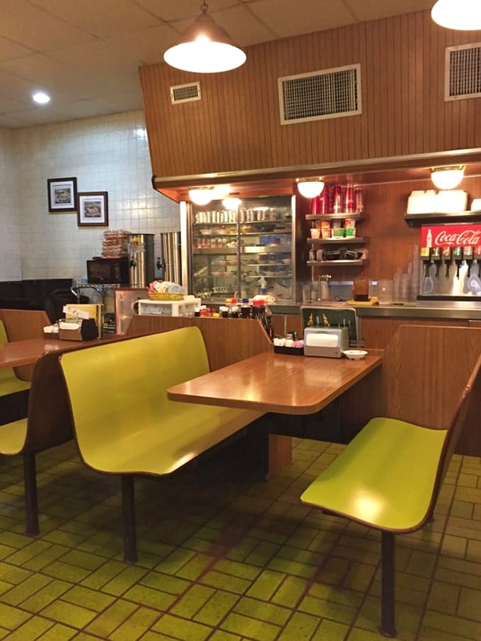 Classic diner booths in mustard yellow take you back to a time when conversations happened face-to-face and coffee refills were unlimited. 