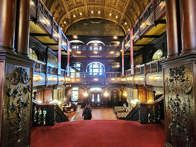 The grand entrance hall stops first-time visitors in their tracks. That barrel-vaulted ceiling and ornate woodwork aren't from a movie set—they're architectural treasures hiding in plain sight.