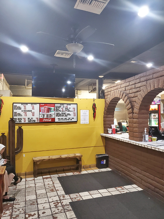 Bright yellow walls and brick arches create the perfect backdrop for flavor magic. No frills needed when the food does all the talking.