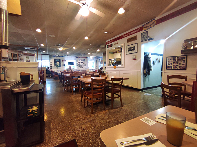 Inside, time slows down as wooden tables, family photos, and the promise of comfort food create a sanctuary from the modern world.