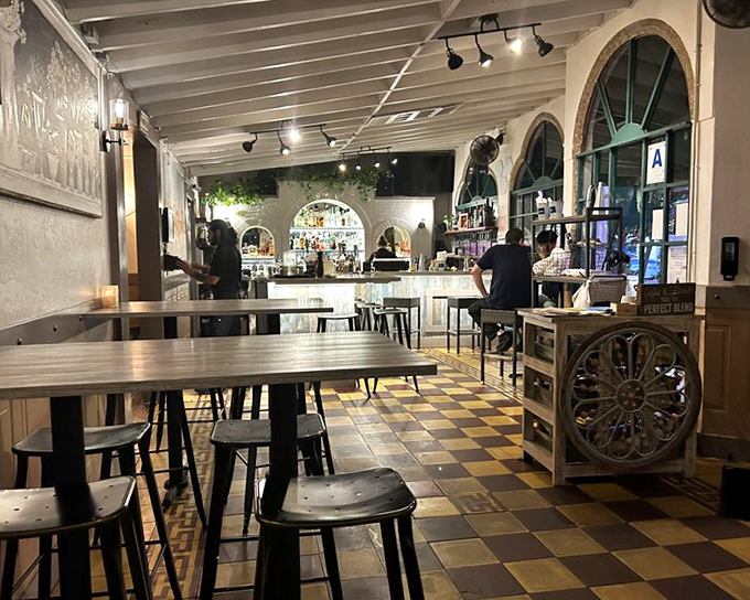 Inside, the checkerboard floors and arched windows create a space that feels both timeless and welcoming&mdash;like Hemingway's living room, but with better food.