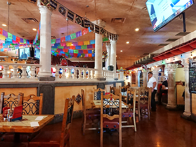 Step inside and the fiesta begins! Colorful papel picado banners and elegant columns create an atmosphere that's part hacienda, part celebration.