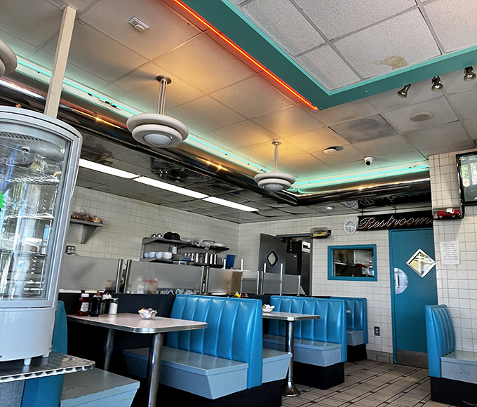 Classic turquoise booths invite you to slide in and stay awhile. This isn't just a diner&mdash;it's a time machine with better coffee and no complicated controls.