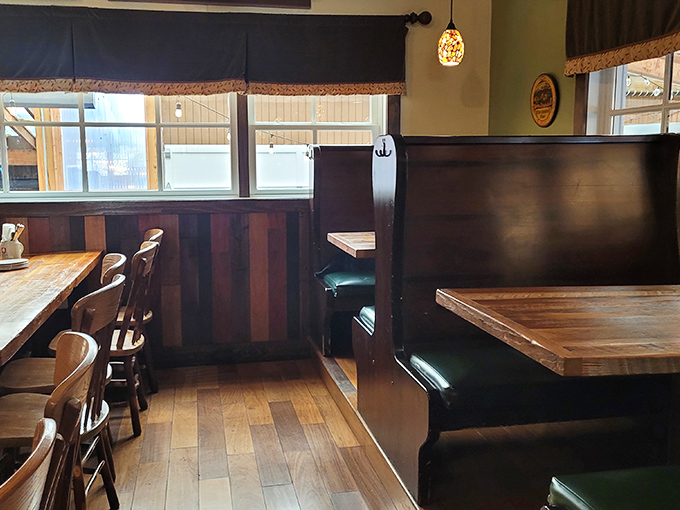 Wooden booths and paneling create that authentic German gemütlichkeit—a coziness that whispers, "Stay awhile, order another beer."