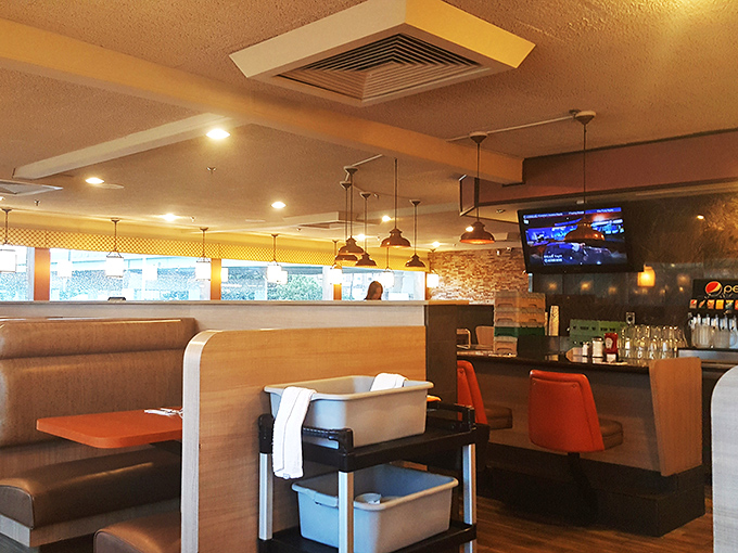 Classic diner comfort meets modern polish inside Penrose, where pendant lighting casts a warm glow over booths that have witnessed countless conversations and coffee refills.