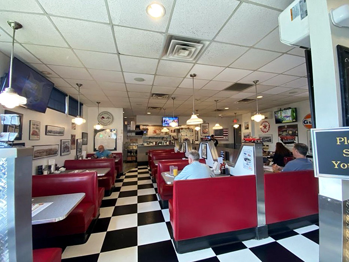 Checkered floors and cherry-red booths create the perfect backdrop for serious potato pancake contemplation sessions.