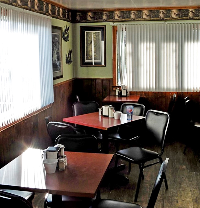 Wood paneling, wildlife prints, and tables set for conversation &ndash; this isn't retro by design, it's authentic by persistence.