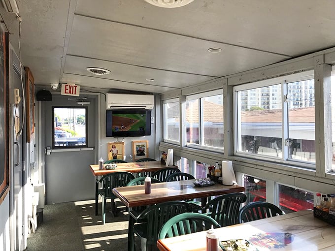 Sunlight streams through windows overlooking the inlet, transforming this humble dining room into a cathedral of casual coastal cuisine. No white tablecloths needed when the view's this good.