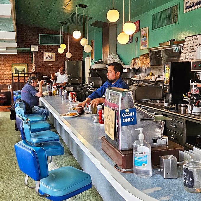 The counter seats aren't just the best show in town—they're front-row tickets to breakfast ballet performed by short-order maestros.