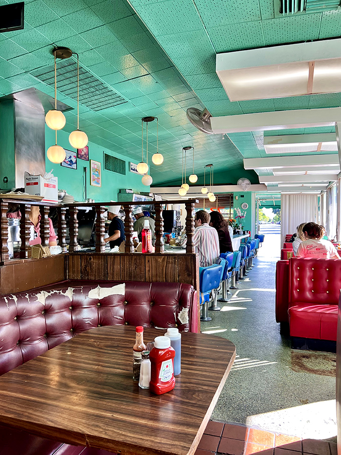 Step inside and the mint-green ceiling, globe lights, and burgundy booths tell you everything: this isn't retro-inspired, it's authentically unchanged&mdash;the real McCoy of diner experiences.