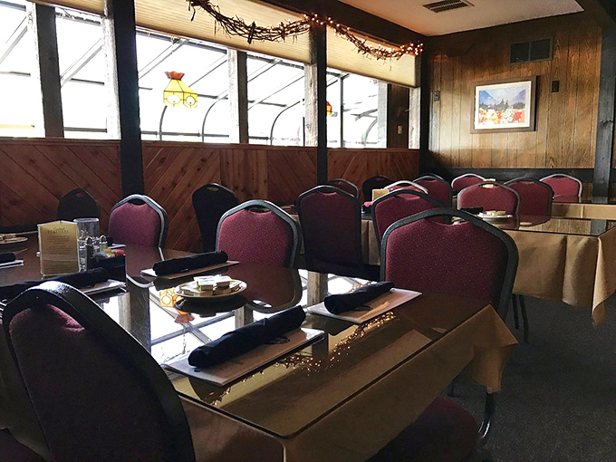 Red chairs await diners like thrones for the evening's beef royalty. Wood paneling and mountain views create the perfect backdrop for meat-induced euphoria.