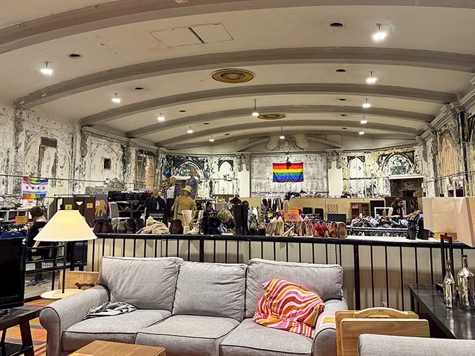 Soaring ceilings and theatrical bones create a shopping experience unlike any other. The rainbow flag reminds shoppers their purchases support Howard Brown Health's vital community services.