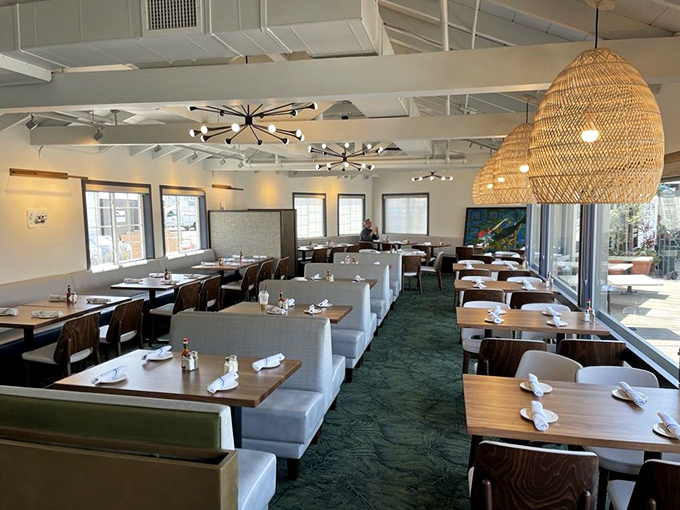 Wicker pendant lights cast a warm glow over white tablecloths and sea-green carpeting&mdash;nautical elegance without a single plastic lobster in sight.