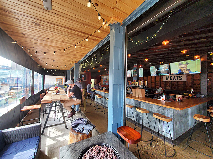 Where wood meets metal meets deliciousness. The interior's warm lighting and "MEATS" sign tell you exactly what matters most at this Pittsburgh BBQ haven.