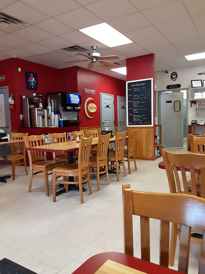 Classic diner charm with those signature red walls. The wooden chairs aren't asking you to linger for hours, but the aromas from the kitchen certainly are.