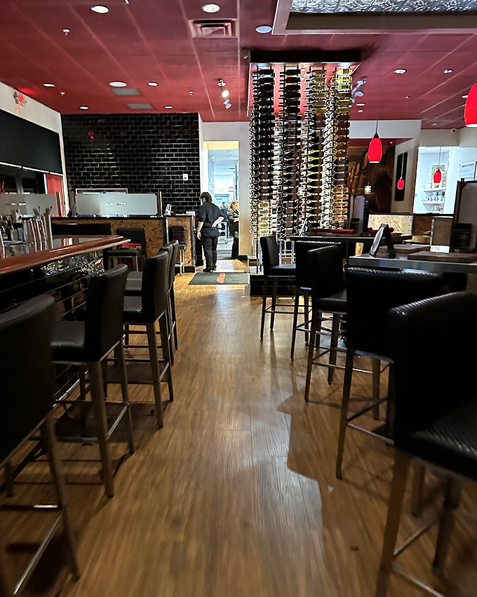 That towering wine display isn't just decoration &ndash; it's a promise of perfect pairings ahead.