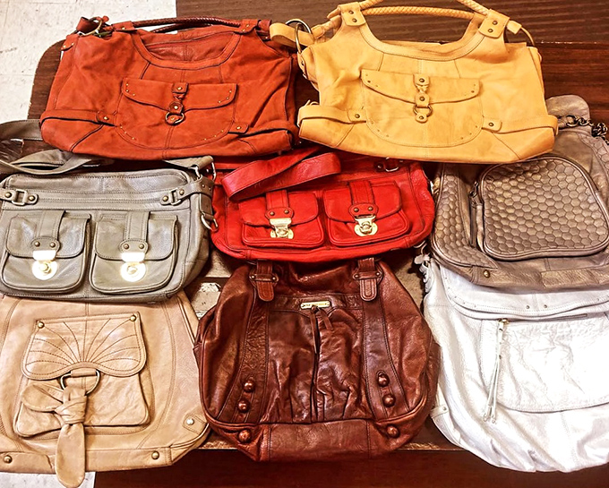 A rainbow of vintage handbags that whisper tales of decades past. Each one could be your next conversation starter at brunch.