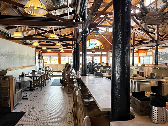 Rustic wooden beams meet nautical charm in this thoughtfully designed interior, where every meal feels like a special occasion without the stuffiness.