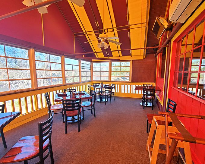 Sunlight floods this cozy dining nook, where wooden walls and simple furnishings create the perfect backdrop for the star of the show&mdash;perfectly grilled beef.